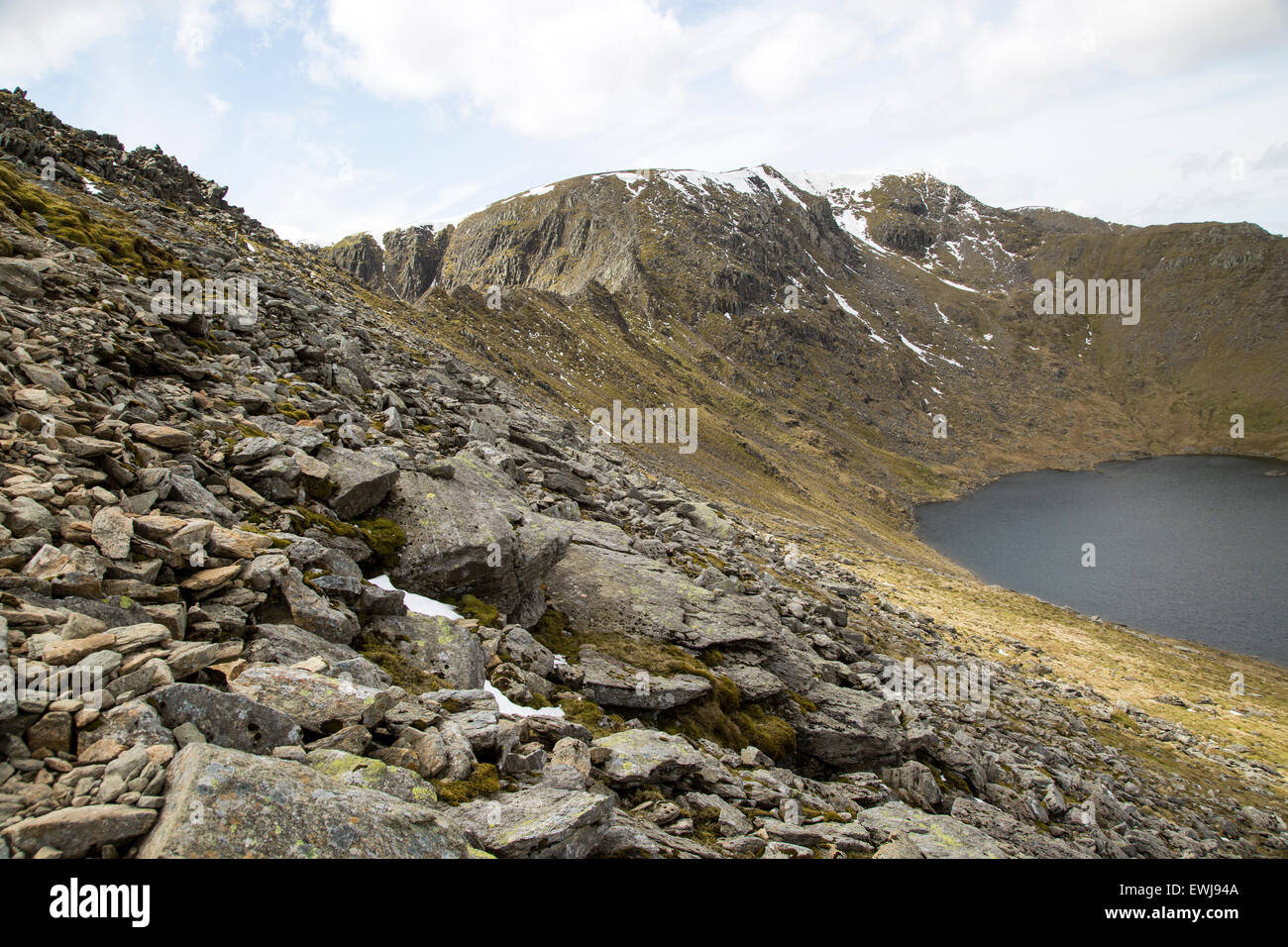Striding Edge arete Helvellyn mountain peak and Red Tarn corrie lake ...