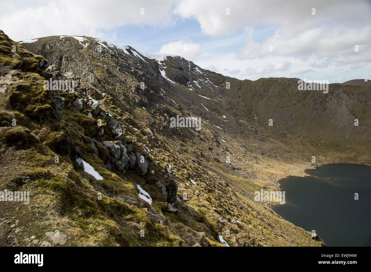 Helvellyn mountain peak and Red Tarn corrie lake, Lake District ...