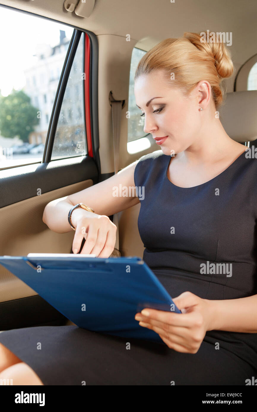 Cheerful young woman checking car hi-res stock photography and images ...