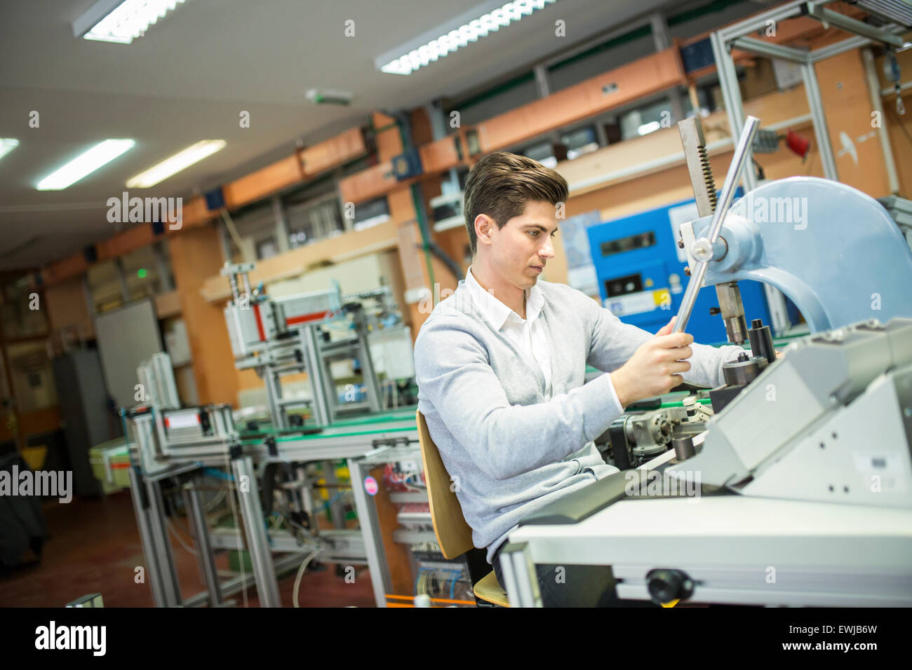Young man in electronics workshop Stock Photo - Alamy