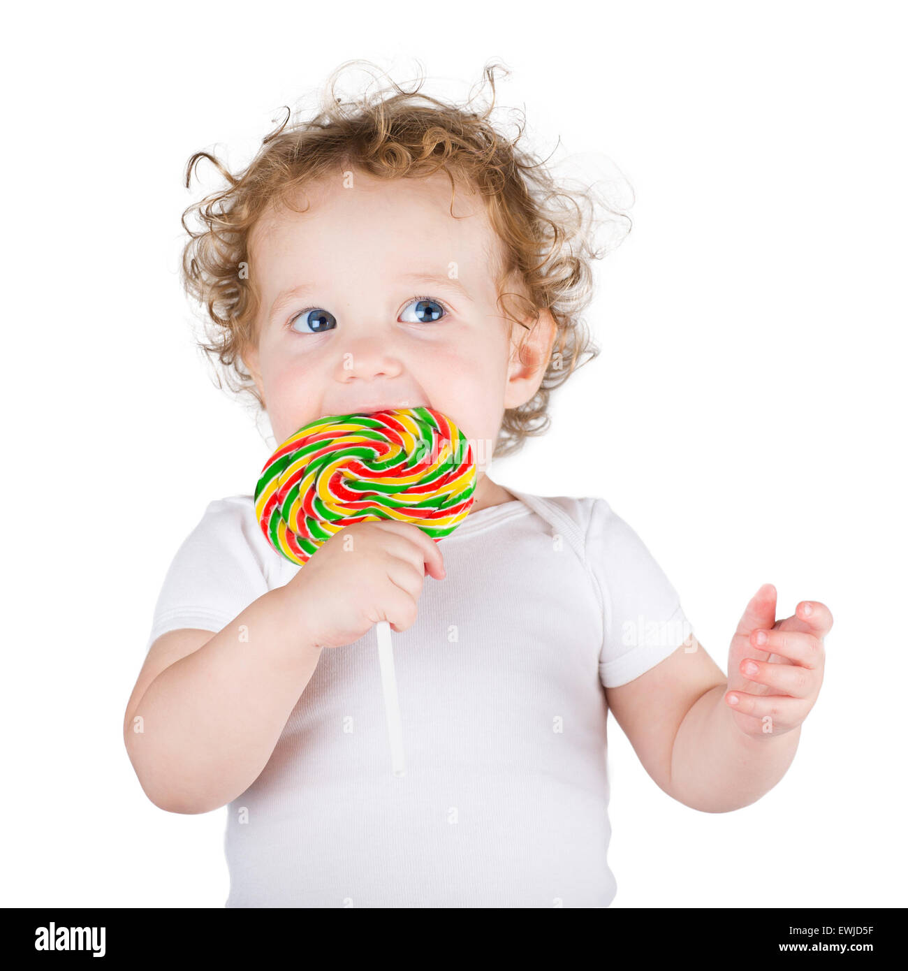 Cute baby with big blue eyes with a colorful candy, isolated on white ...