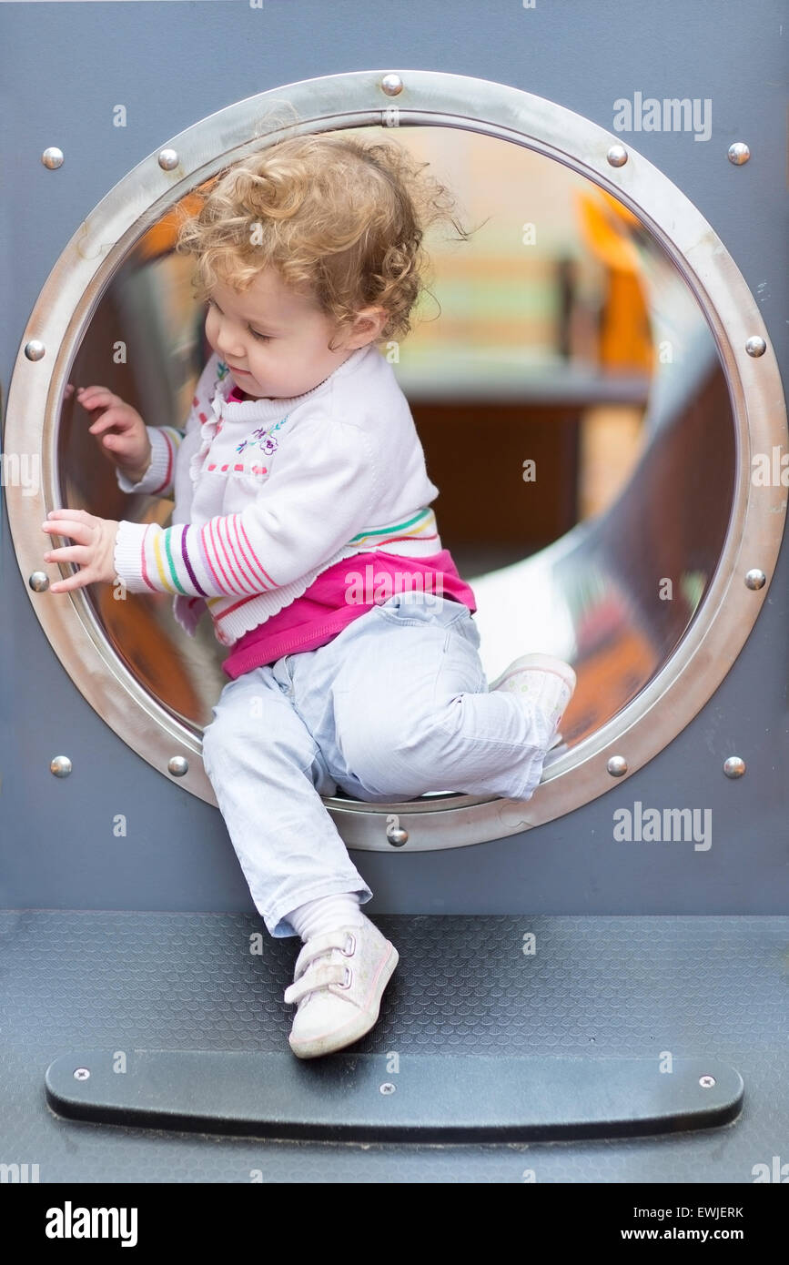 Baby climbing small slide hi-res stock photography and images - Alamy