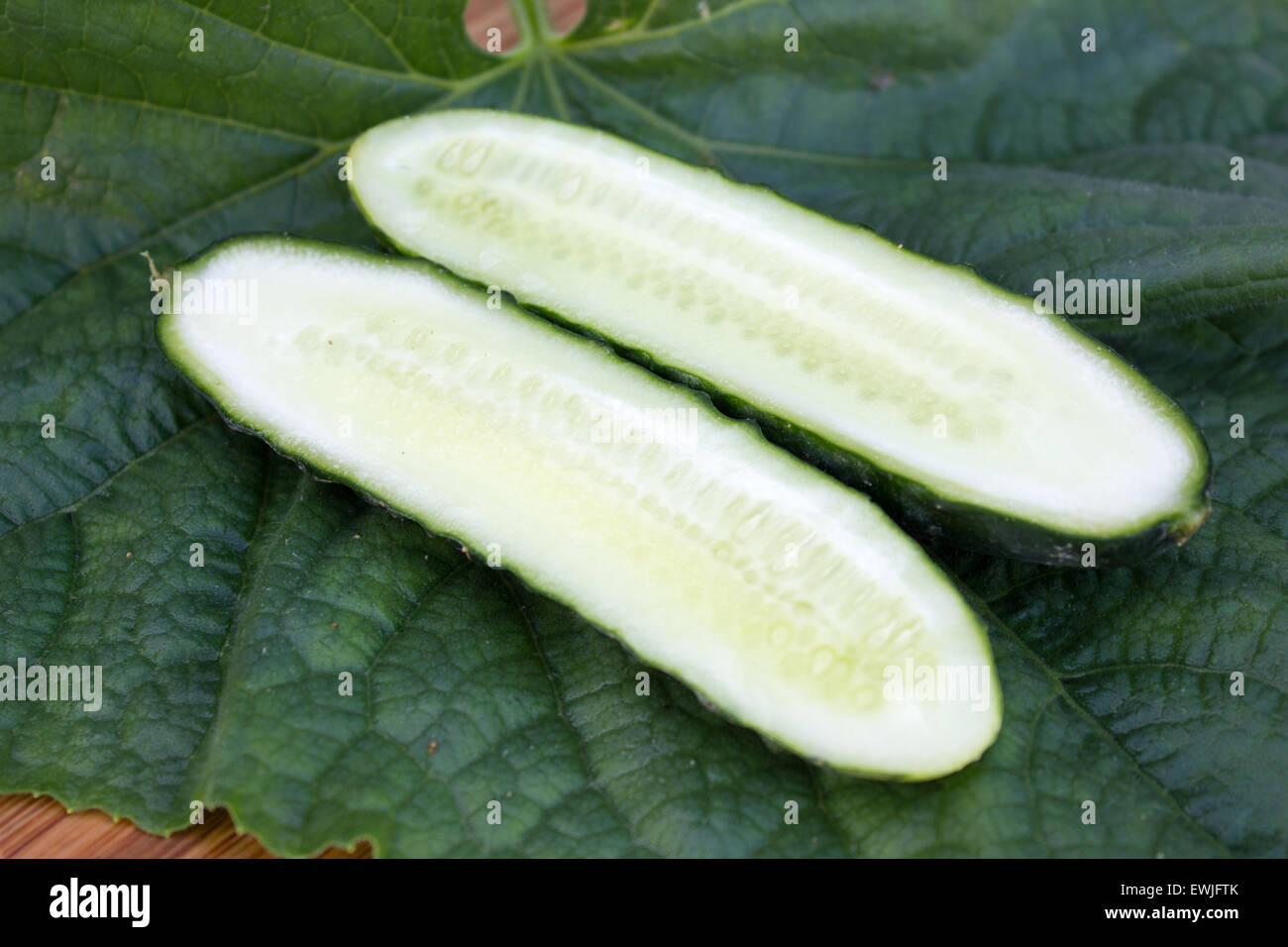 sliced cucumber stack on wooden plate Stock Photo - Alamy