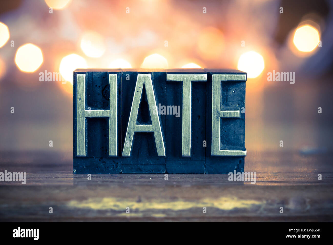 The word HATE written in vintage metal letterpress type on a soft ...