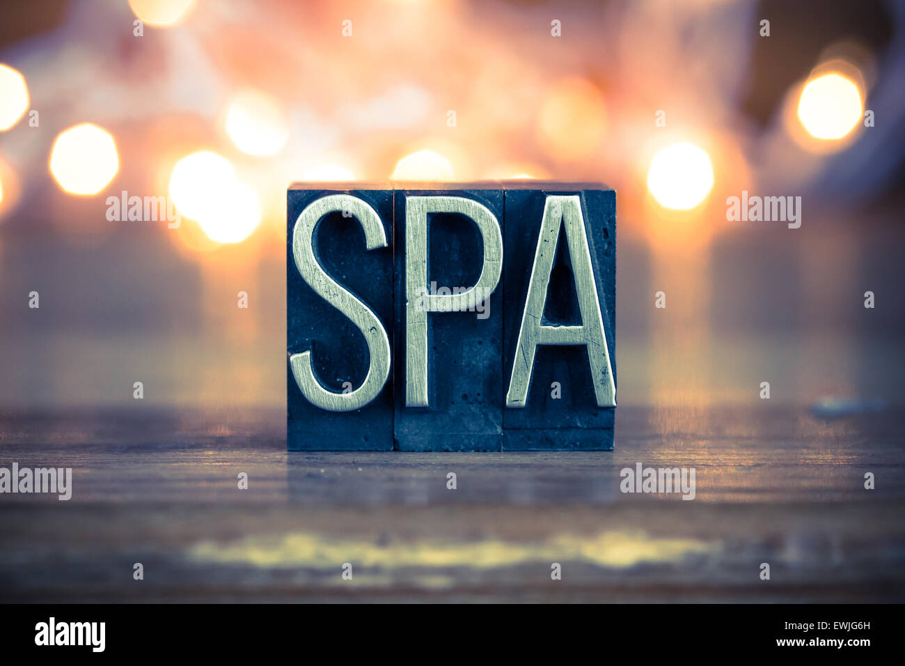 The word SPA written in vintage metal letterpress type on a soft ...