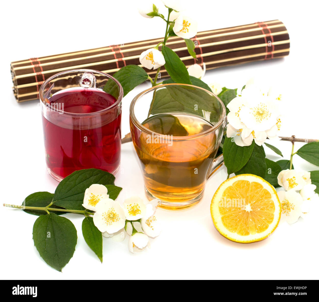 glass of yellow and red drink, treatment by herbs Stock Photo - Alamy