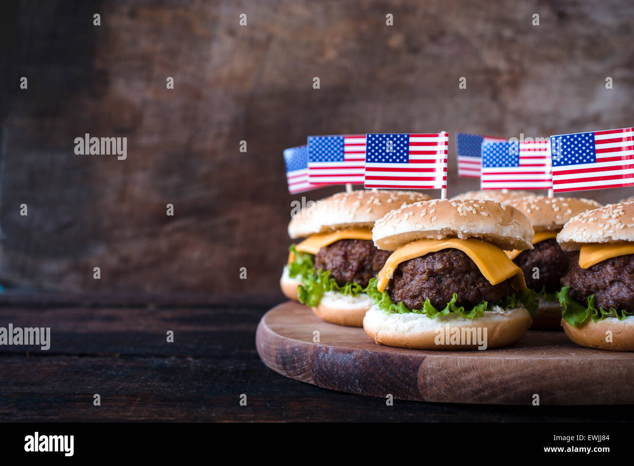 Mini beef burgers with American flag on wooden backgound,selective ...