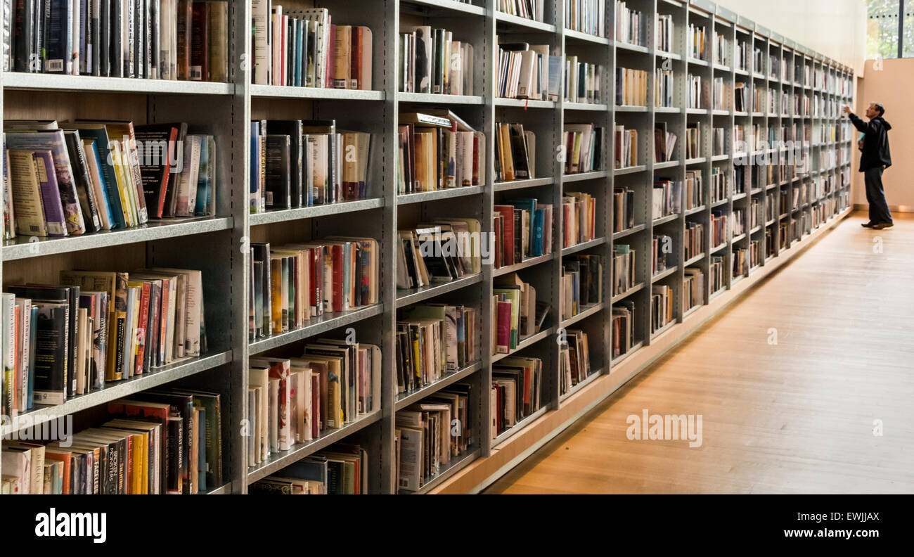 Futuristic interior of the Library of Birmingham with shelves of books ...