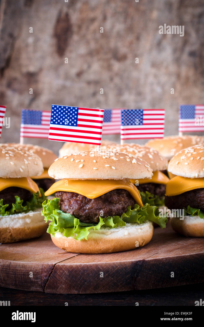 Mini beef burgers with American flag on wooden backgound,selective ...