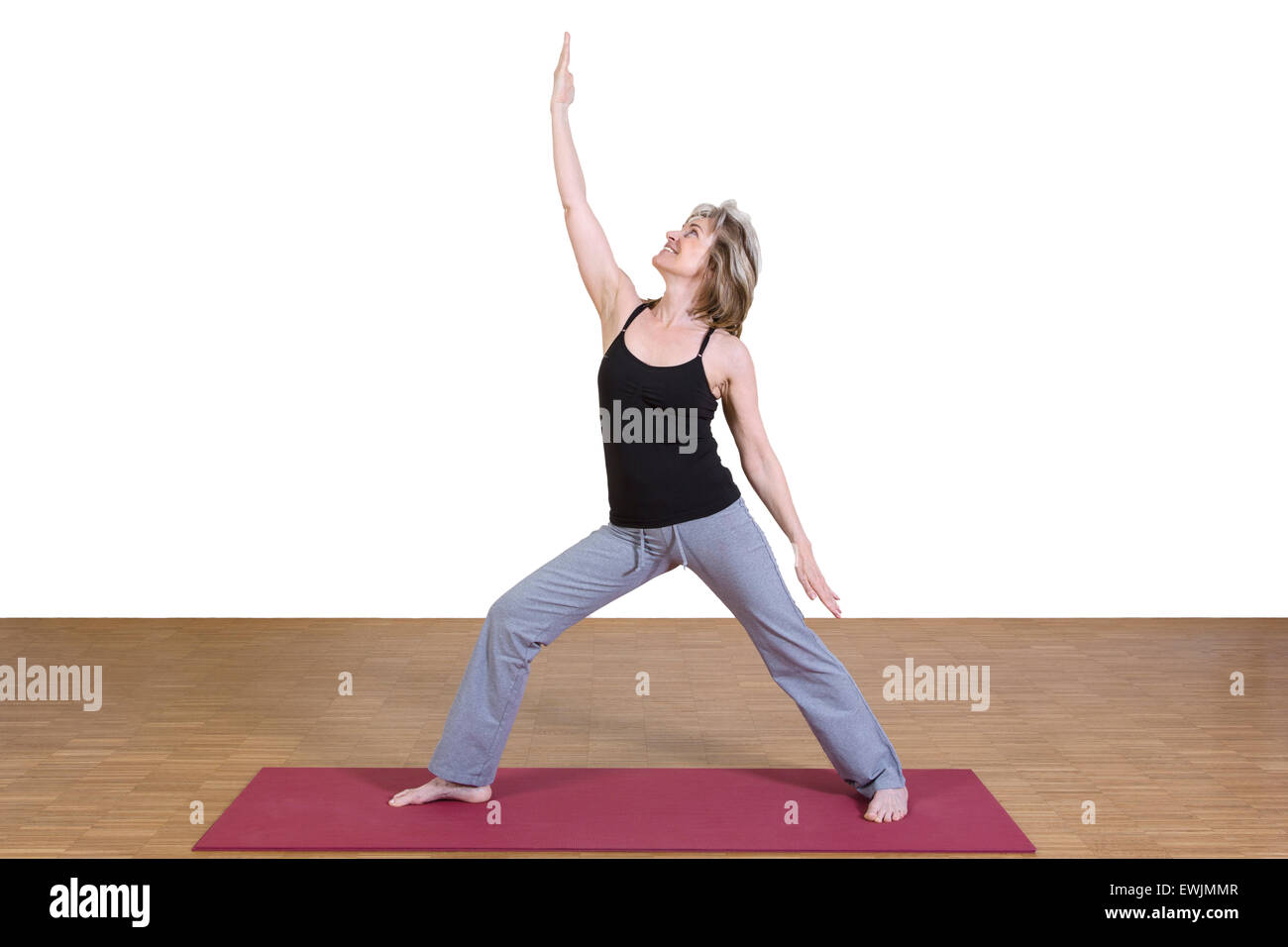 female yoga coach shows exercise Stock Photo - Alamy