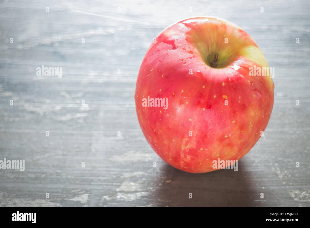 Red apple on the table, stock photo Stock Photo - Alamy