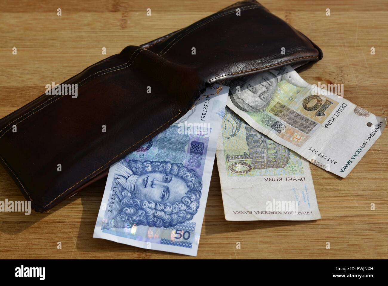 Money in a wallet Stock Photo - Alamy