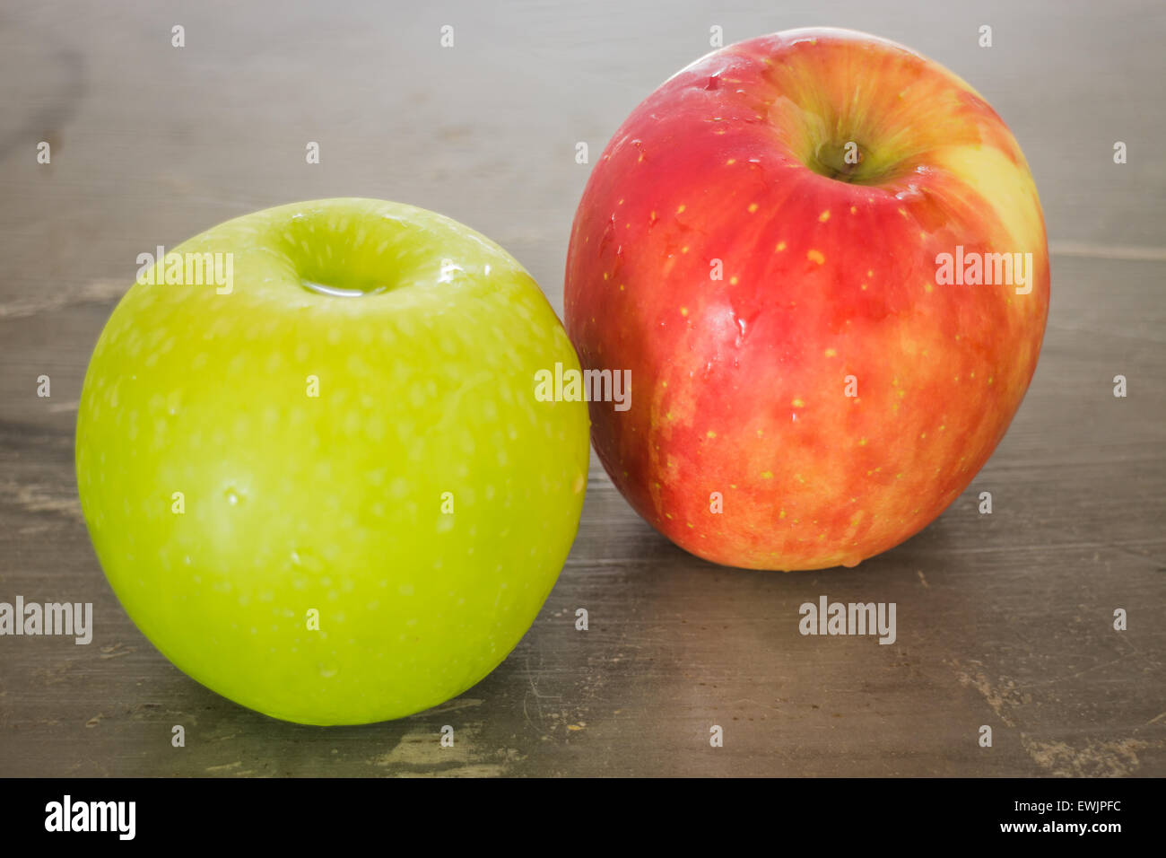 Green and red apple on the table, stock photo Stock Photo - Alamy