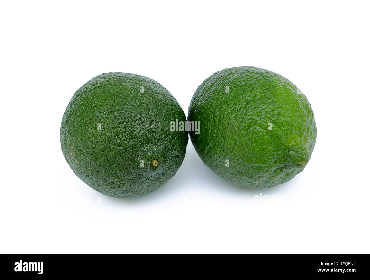two limes on a white background Stock Photo - Alamy