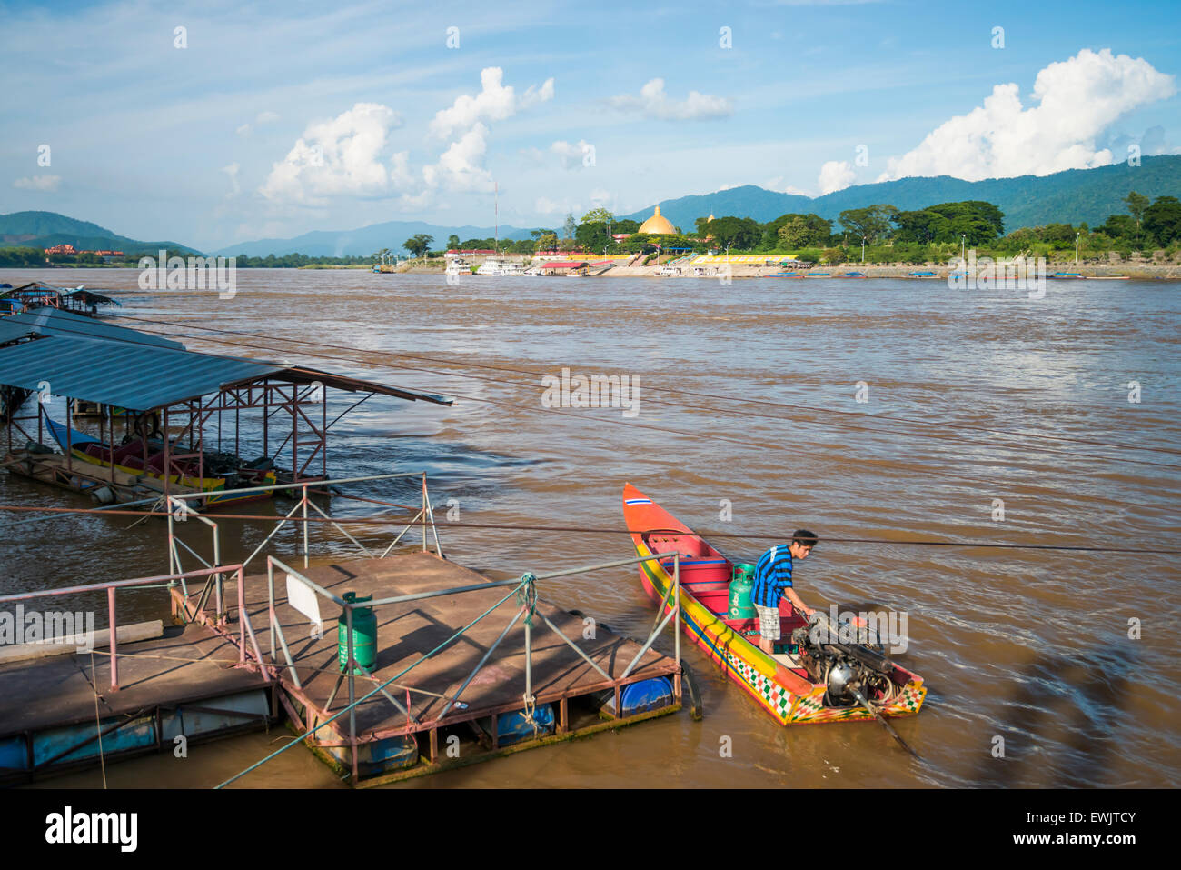 Golden Triangle River Boat with a View of Laos Stock Photo - Alamy