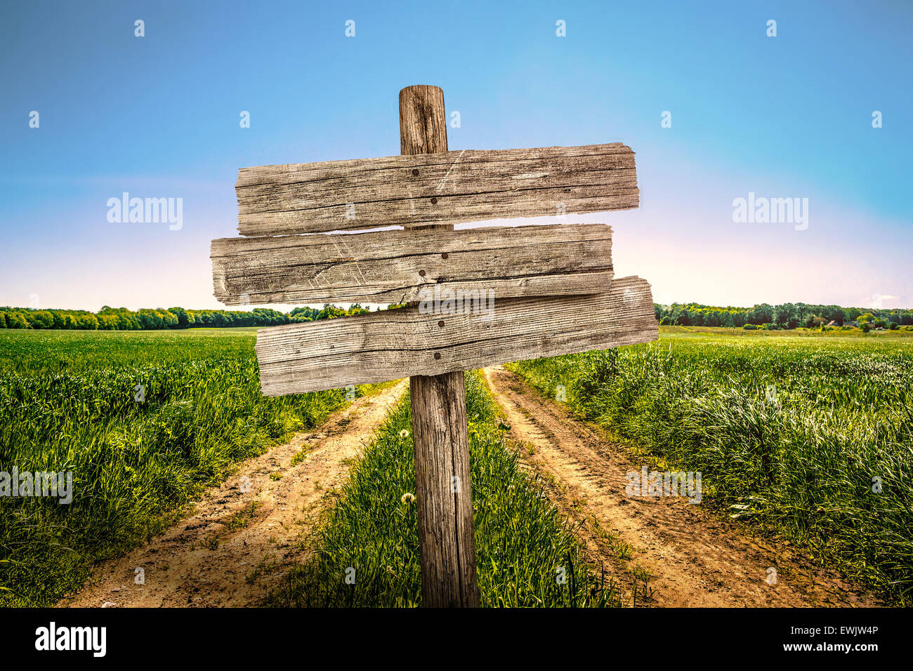 Grunge wooden sign on a countryside road Stock Photo - Alamy