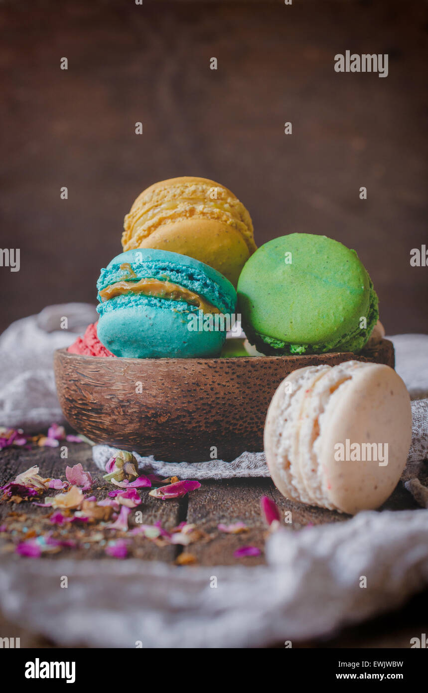 Colorful macaroon cookies in wooden bowl,selective focus and blank ...