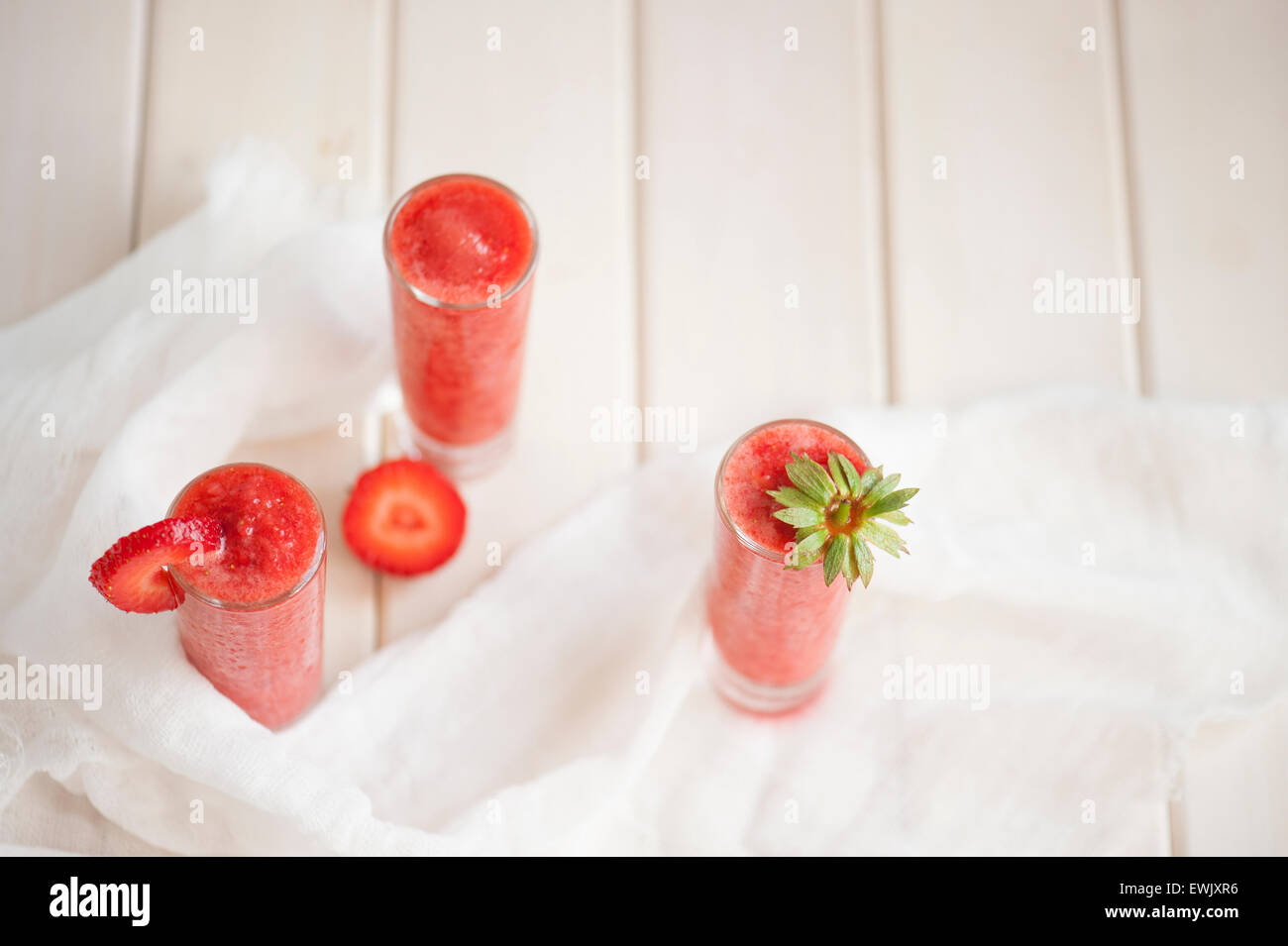 Strawberry cocktail on the wooden white table Stock Photo - Alamy