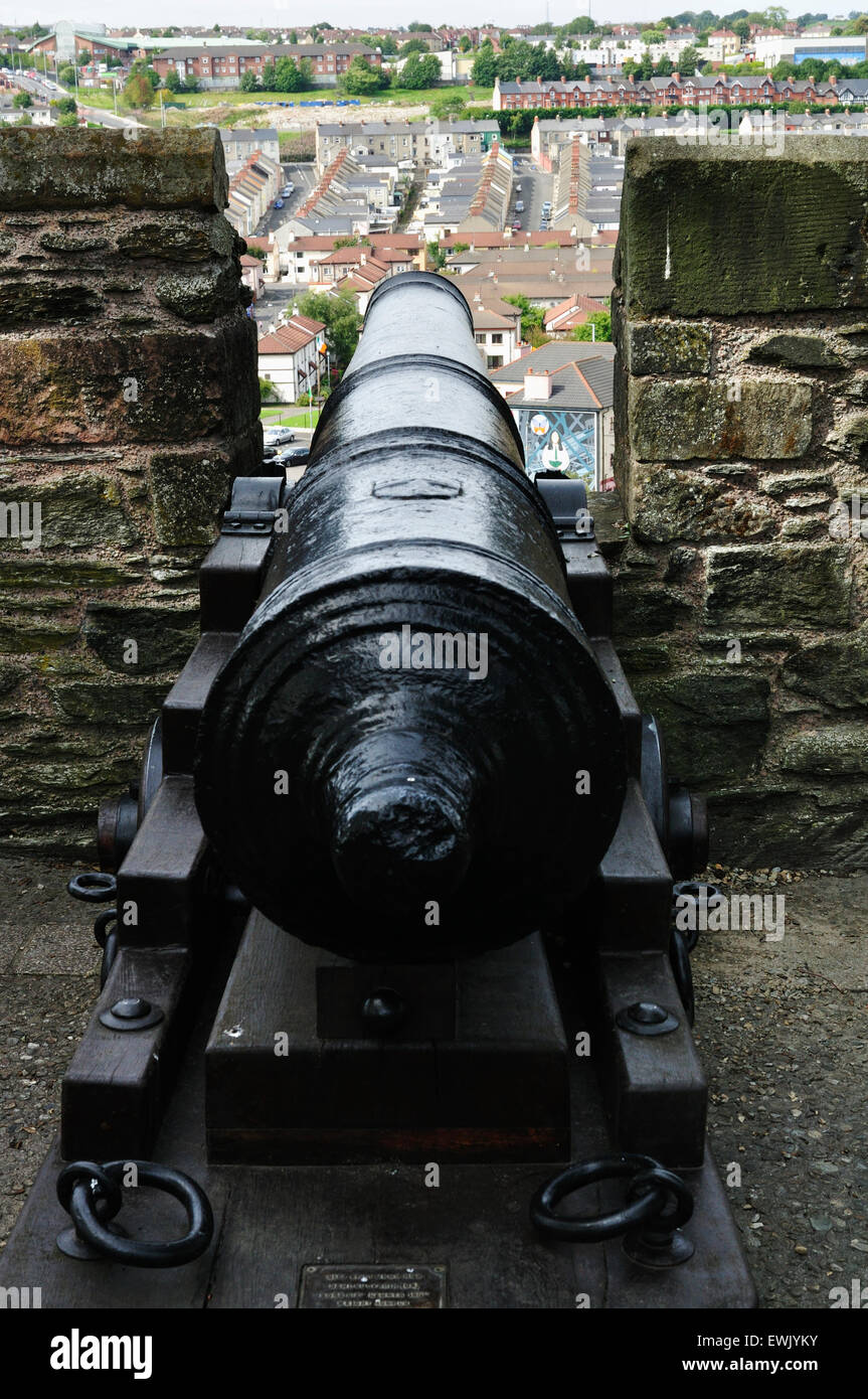 A cannon sits atop the historic Derry Walls, which look over The ...