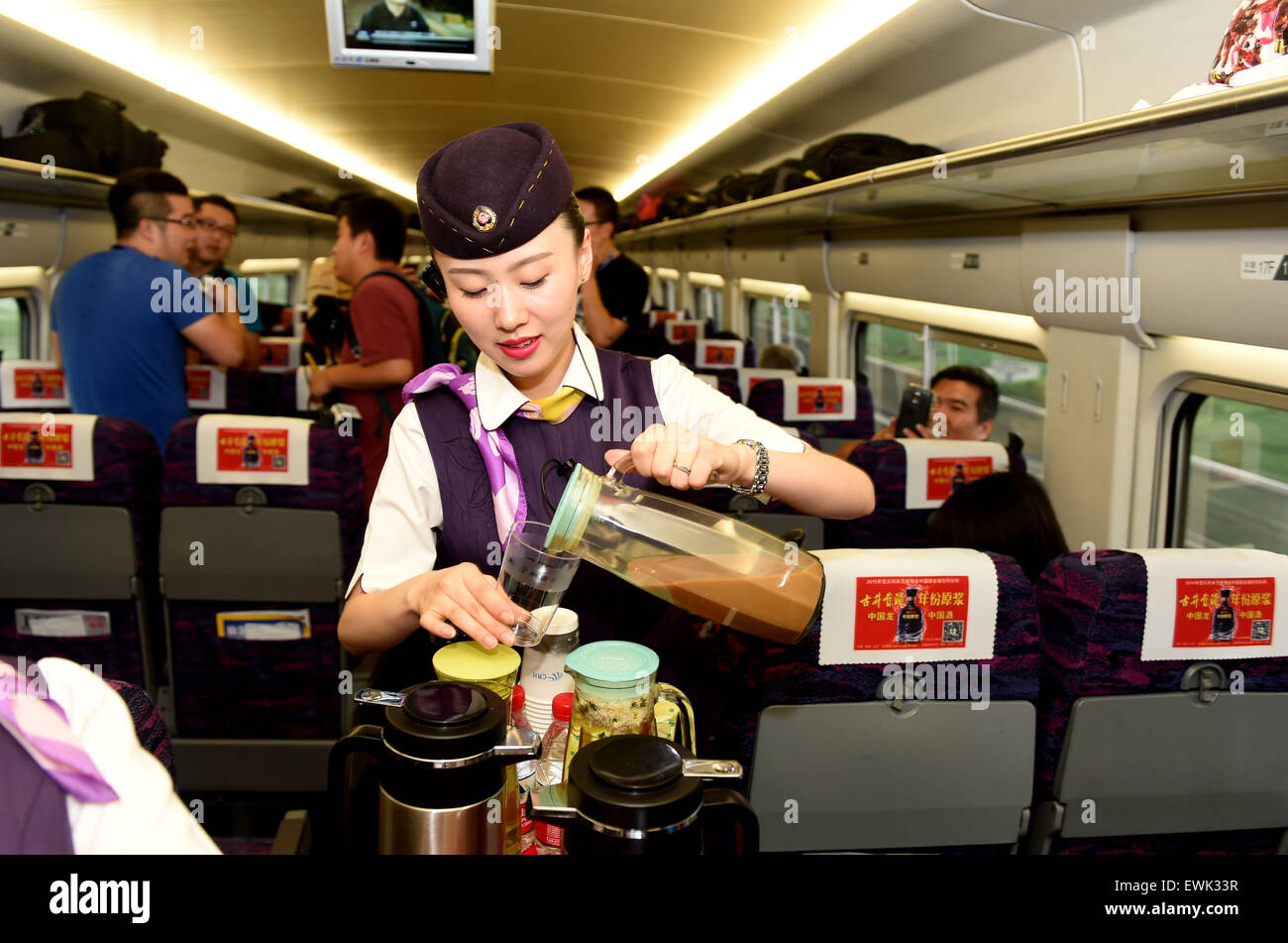 Hefei. 28th June, 2015. A steward of the G2621 high-speed train from ...