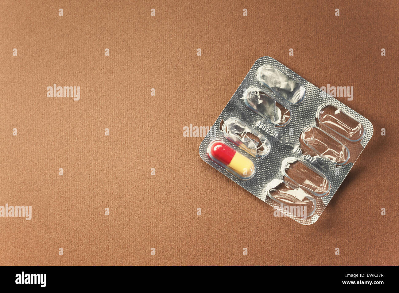 Conceptual composition, empty pills pack with just one left ...