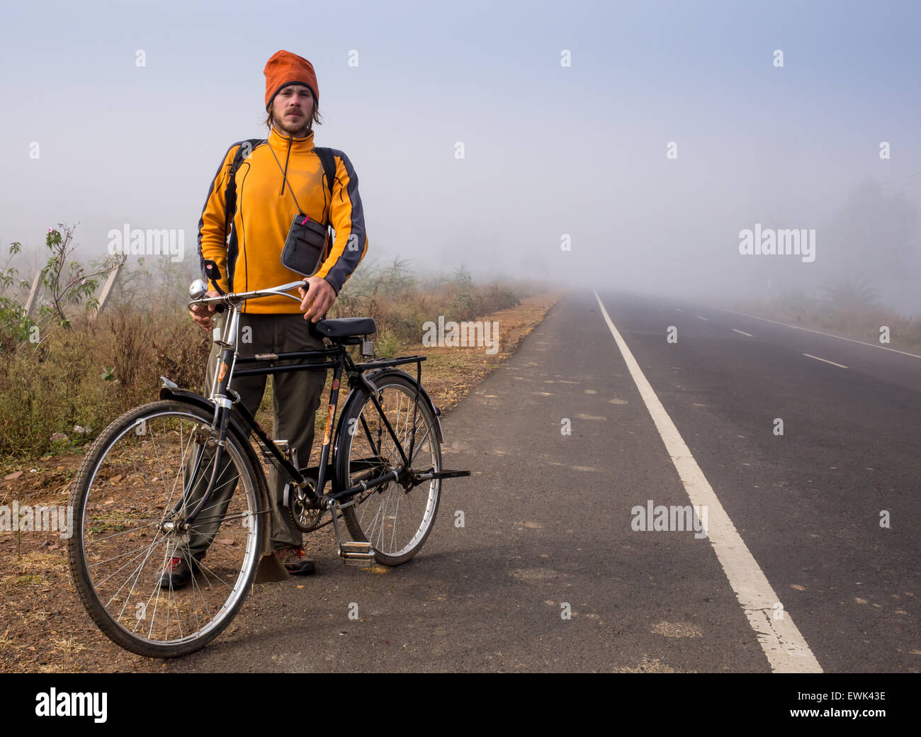 Man riding bicycle on asphalt hi-res stock photography and images - Alamy