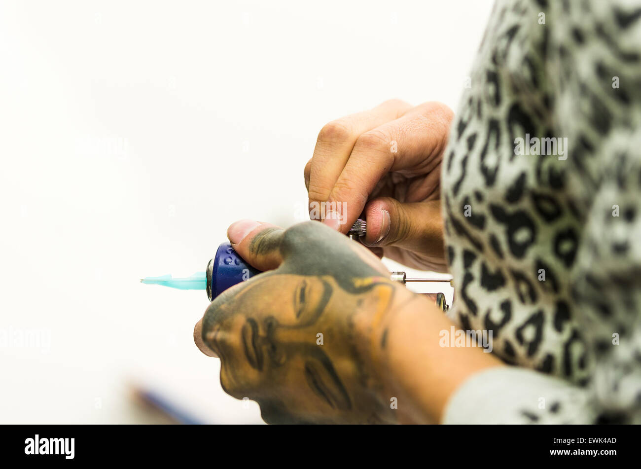 Fixing tattoo machine Stock Photo - Alamy