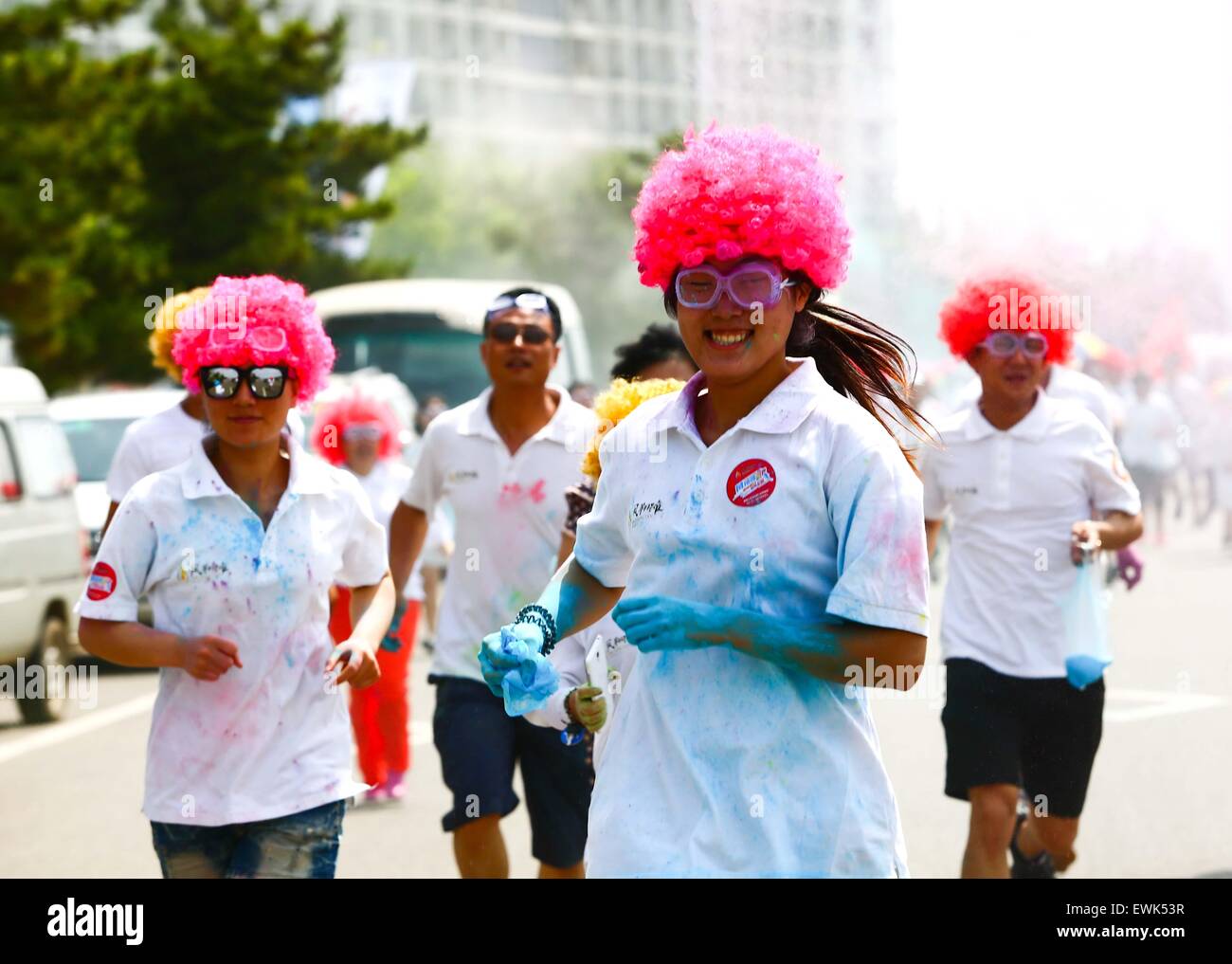 Yantai, China's Shandong Province. 28th June, 2015. People take part in ...