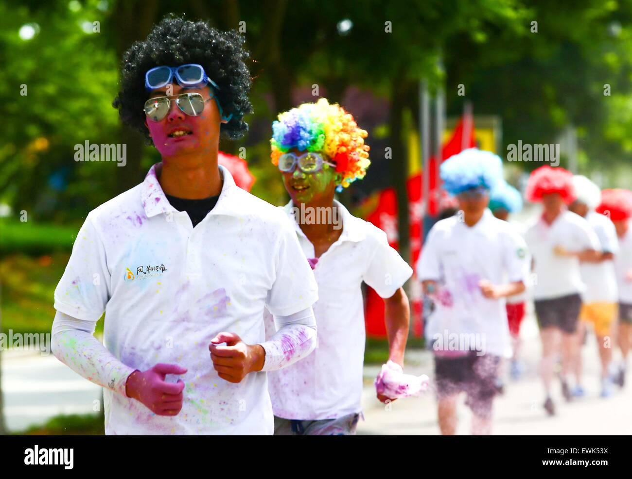 Yantai, China's Shandong Province. 28th June, 2015. People take part in ...
