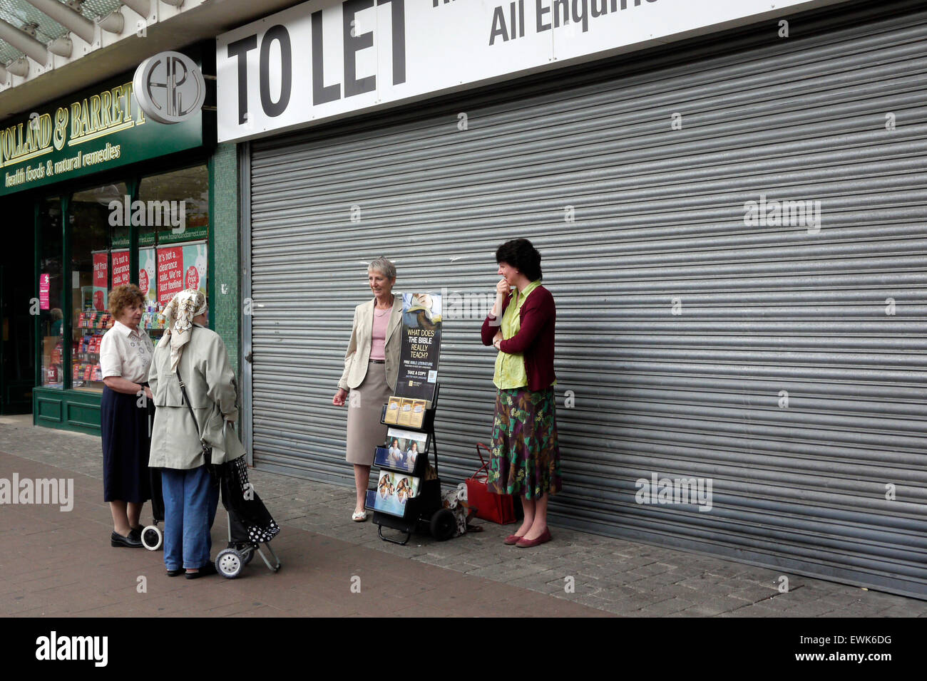 Two females talking about their faith while handing out religious ...