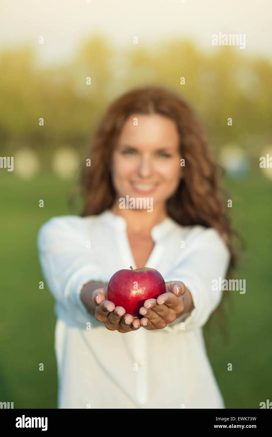 Woman with apple Stock Photo - Alamy