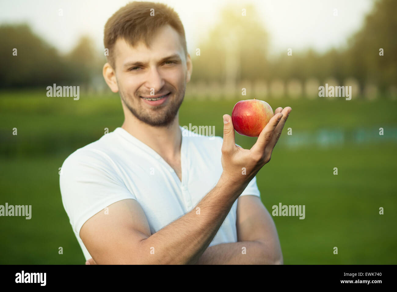 Man with apple Stock Photo - Alamy
