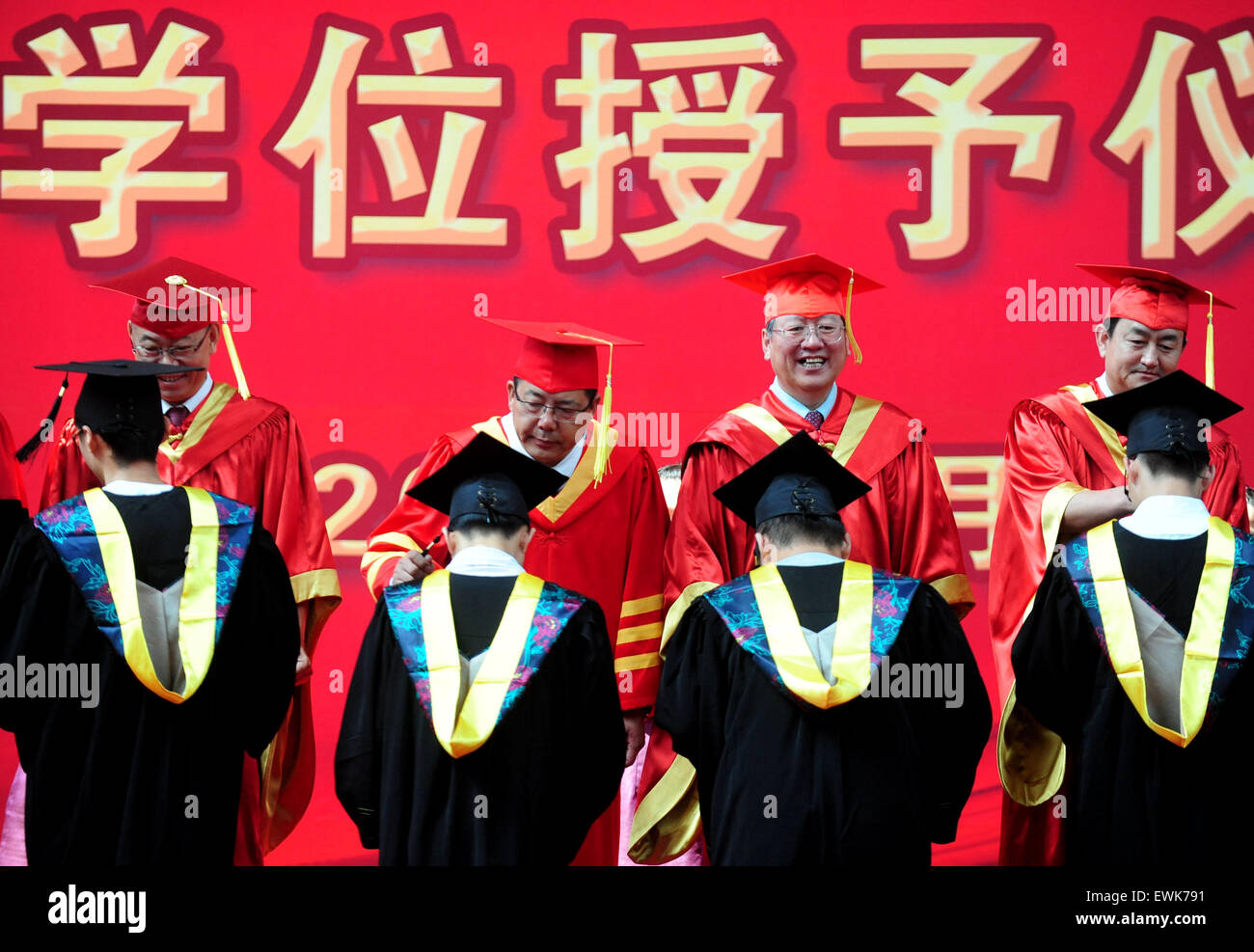 University graduates attend graduation ceremony hi-res stock ...