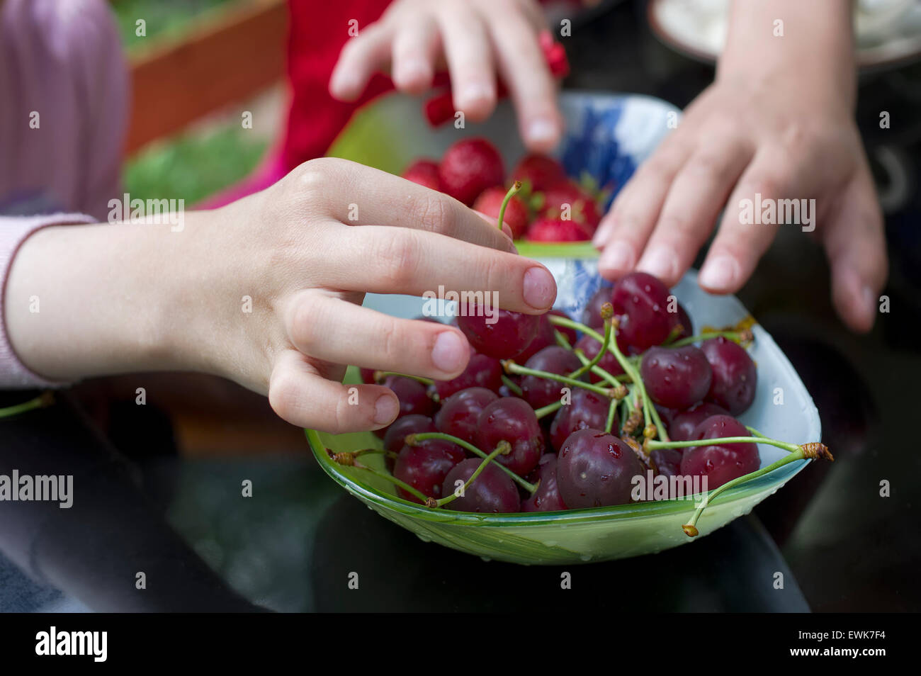 Children eating cherry Stock Photo - Alamy