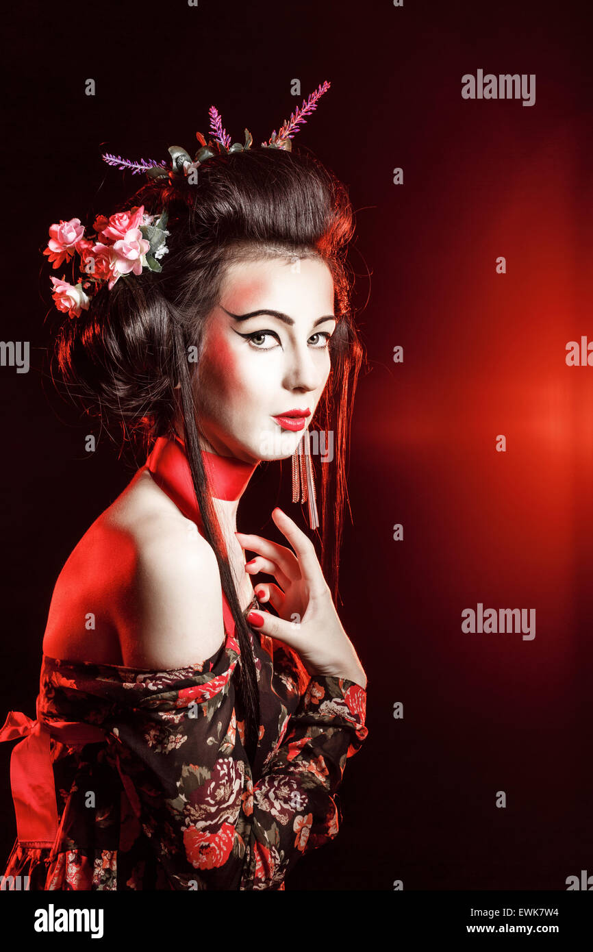 The concept of Japanese traditions. Geisha with traditional makeup and ...