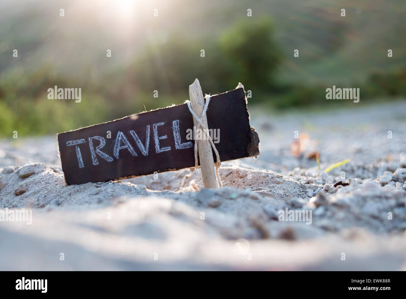 Travel concept. Sign with the word travel on the beach Stock Photo - Alamy