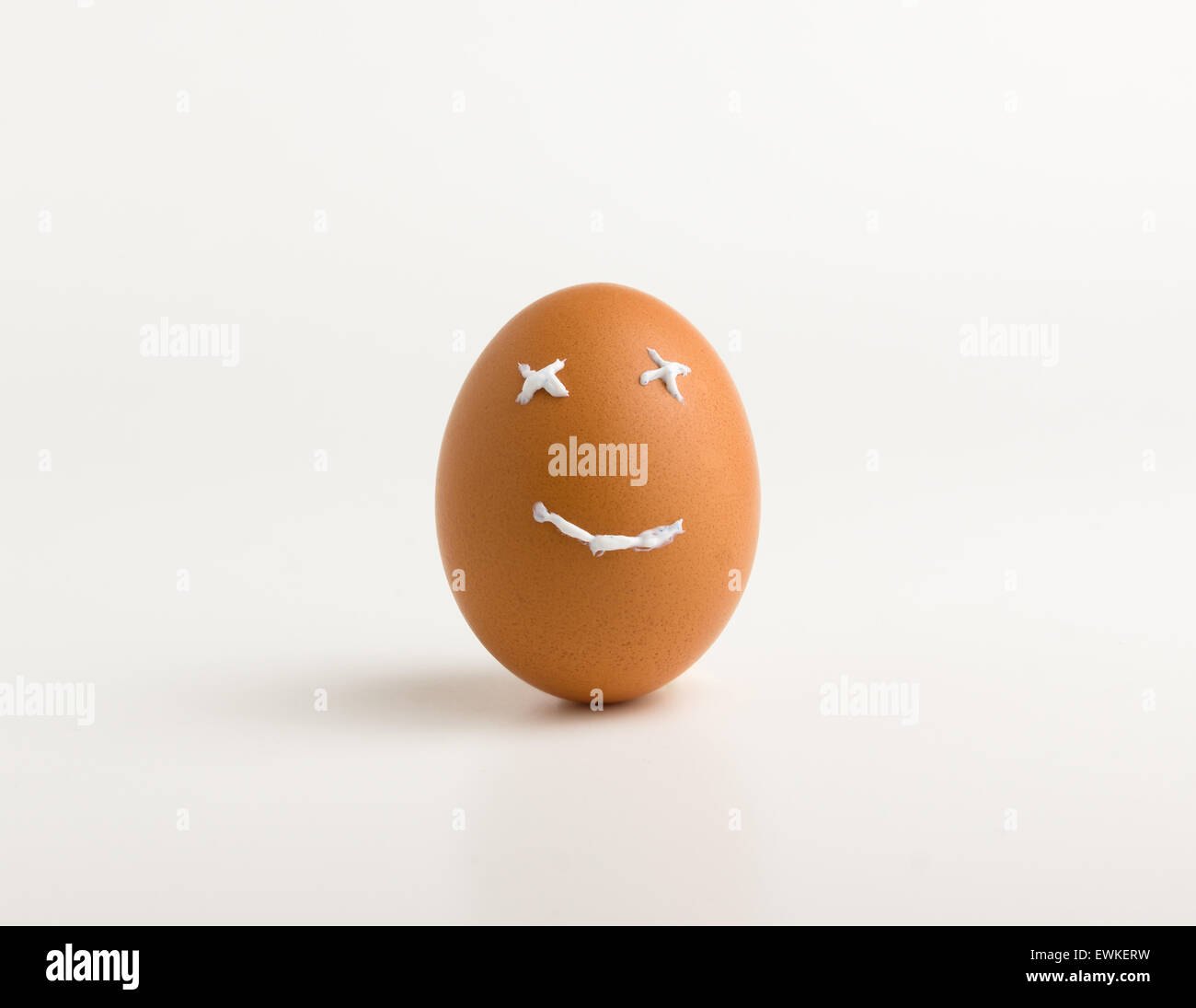 egg with a smile from a toothpaste on a white background Stock Photo ...