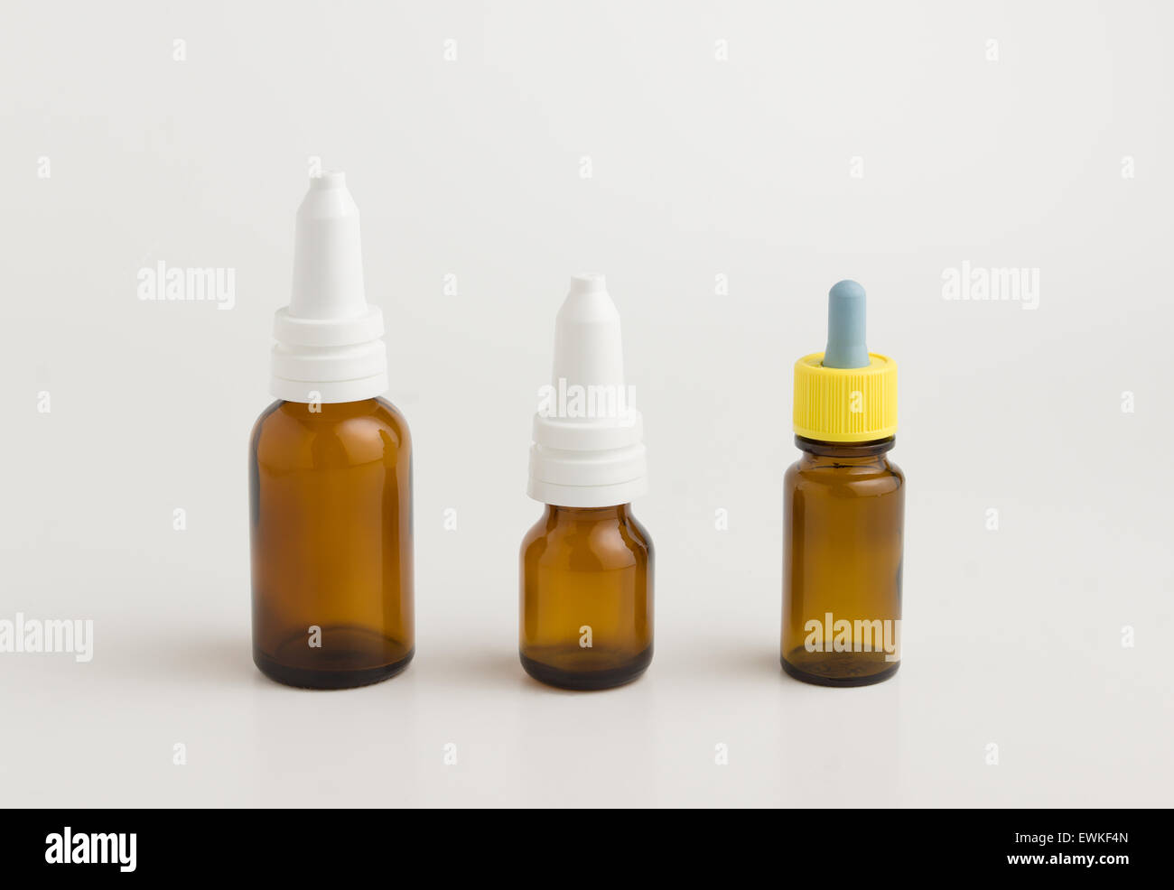many medical bottles with caps on a white background Stock Photo - Alamy