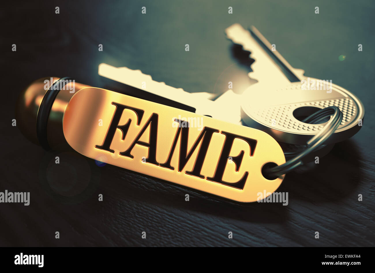 Fame written on Golden Keyring Stock Photo - Alamy