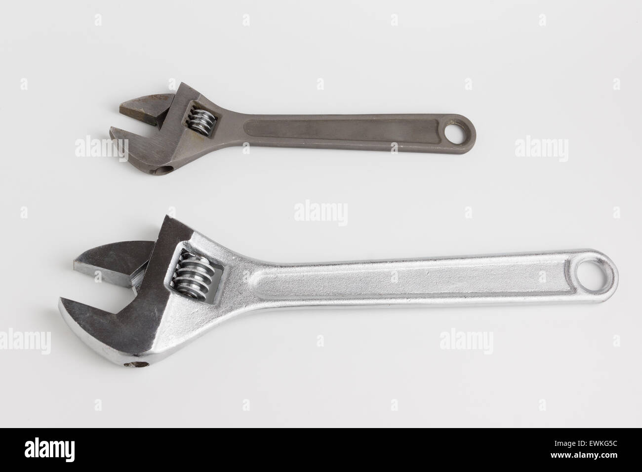 two adjustable wrenches on a white background Stock Photo - Alamy