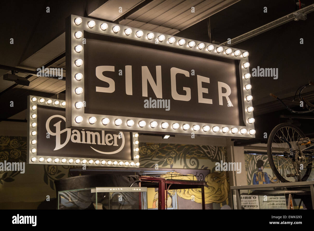 Singer and Daimler vintage antique illuminated signs on display at ...