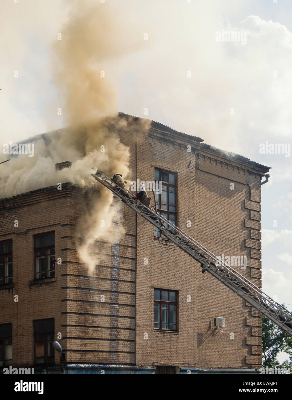 extinguishing a fire in an old three-storey building Stock Photo - Alamy