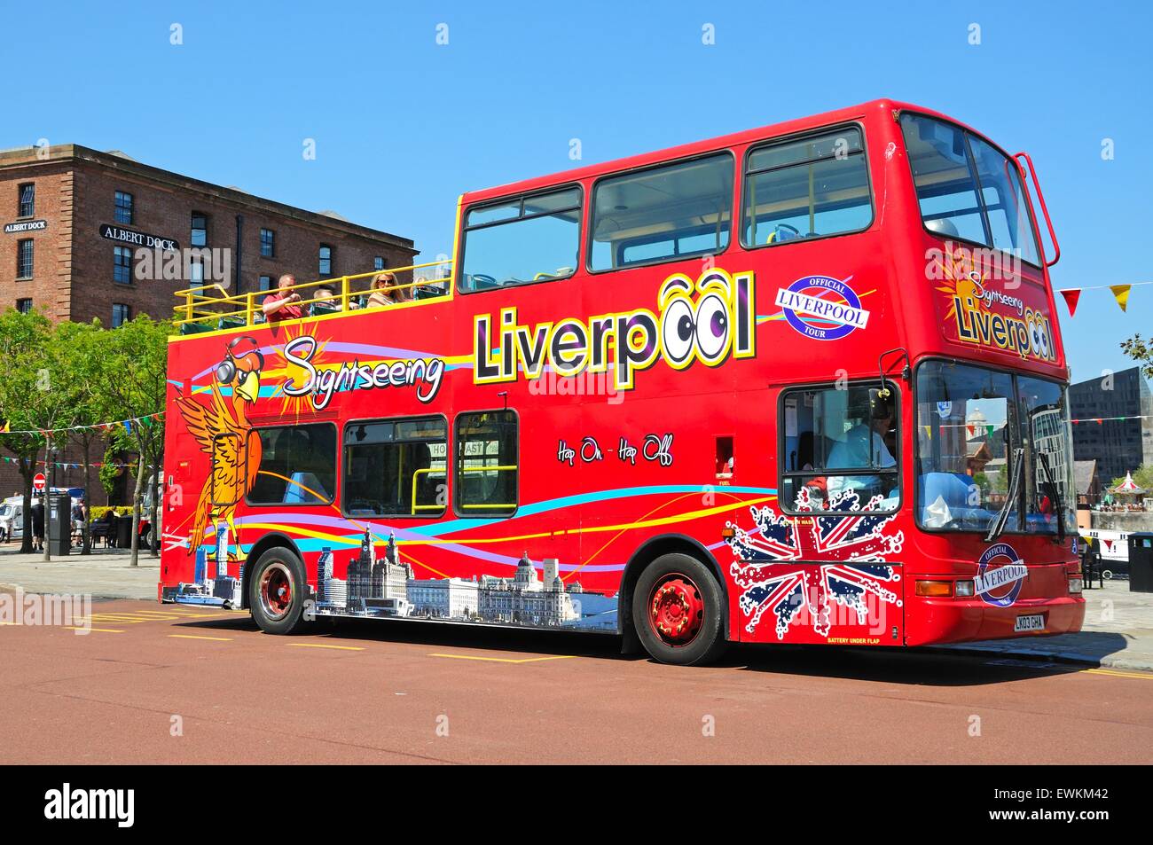 Red tour bus outside Albert Dock, Liverpool, Merseyside, England, UK ...