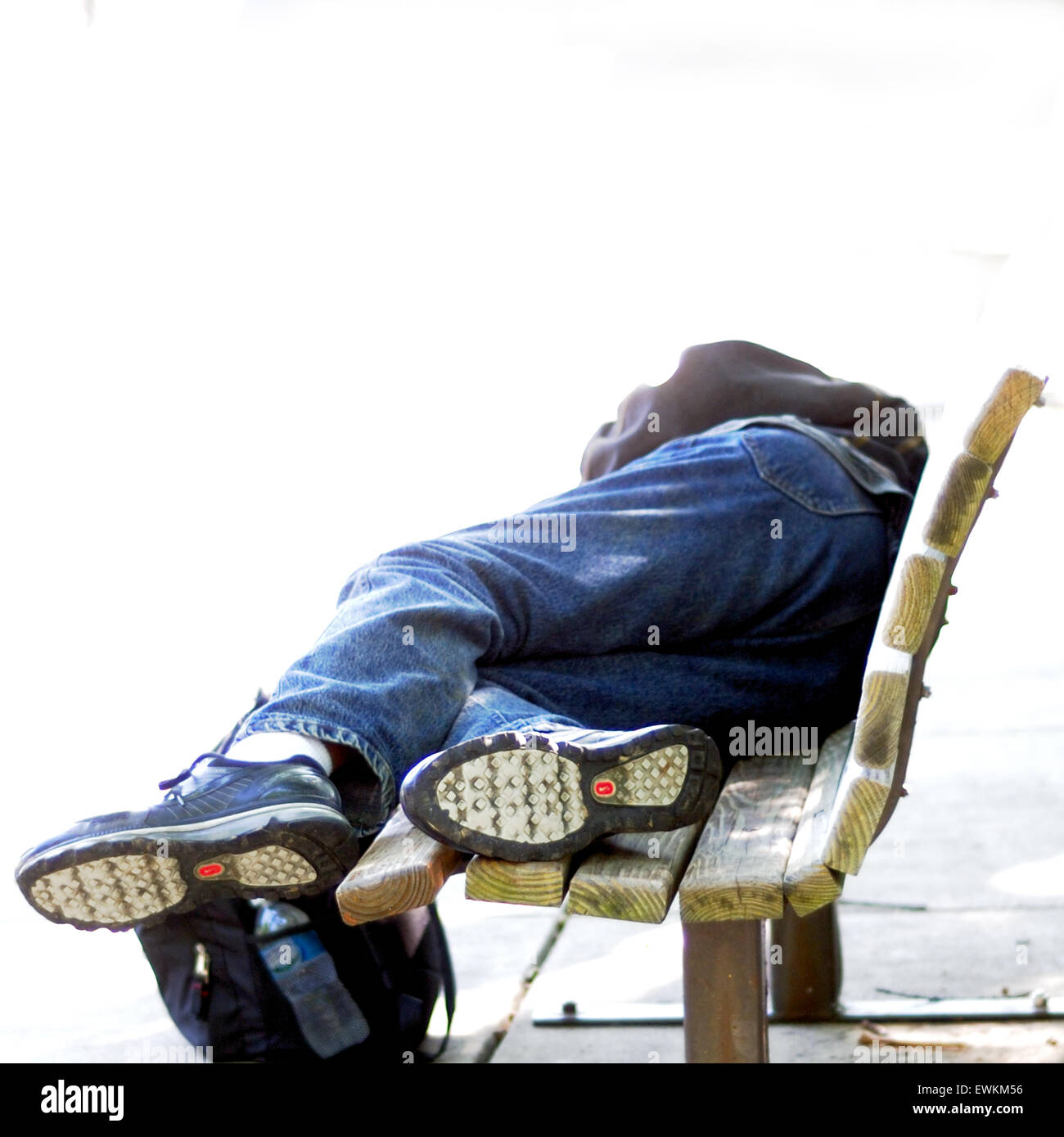 Homeless man sleeping on bench in a public park Stock Photo - Alamy