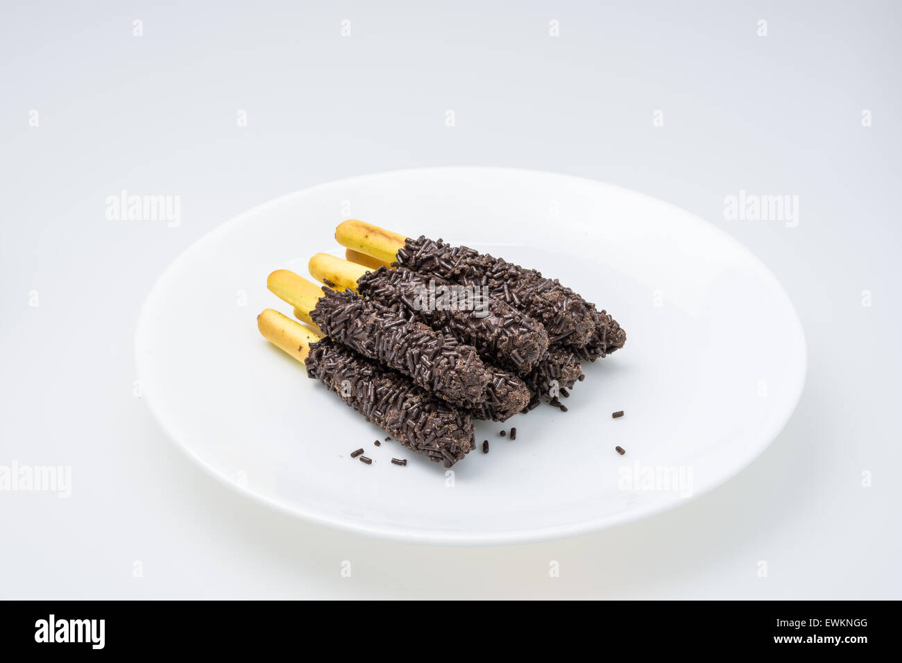 Sweet bread sticks Chocolate in white platev Stock Photo - Alamy