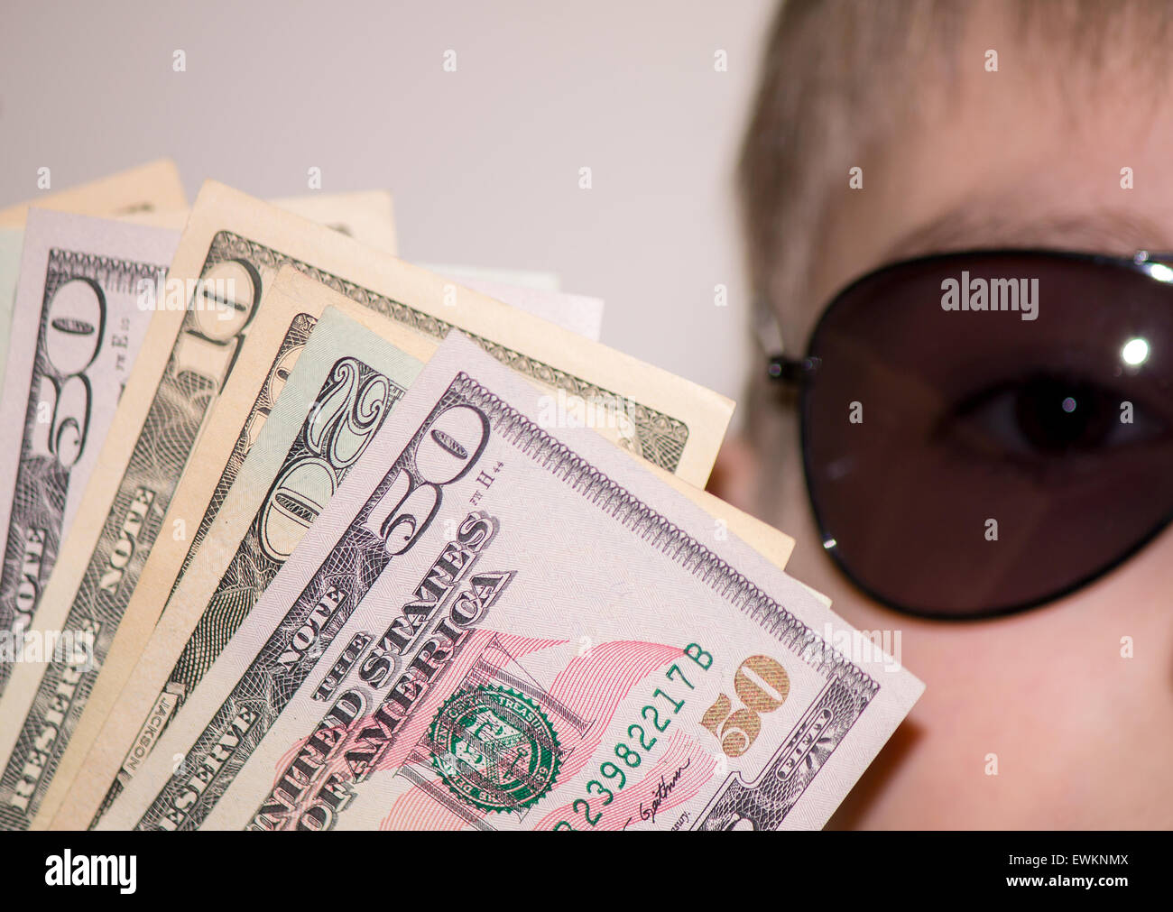 Dollars and sunglasses on a white background isolated Stock Photo - Alamy