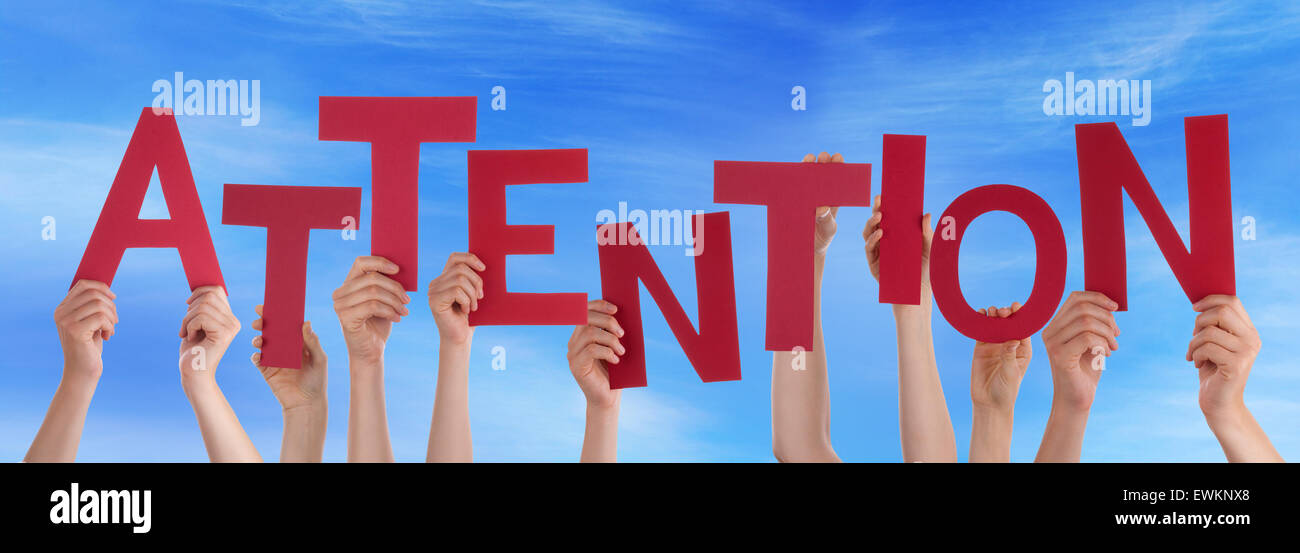 Many People Hands Hold Red Word Attention Blue Sky Stock Photo - Alamy