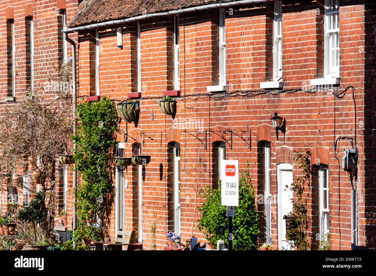 Compressed perspective view along orange brick terrace of 2 up 2 down ...