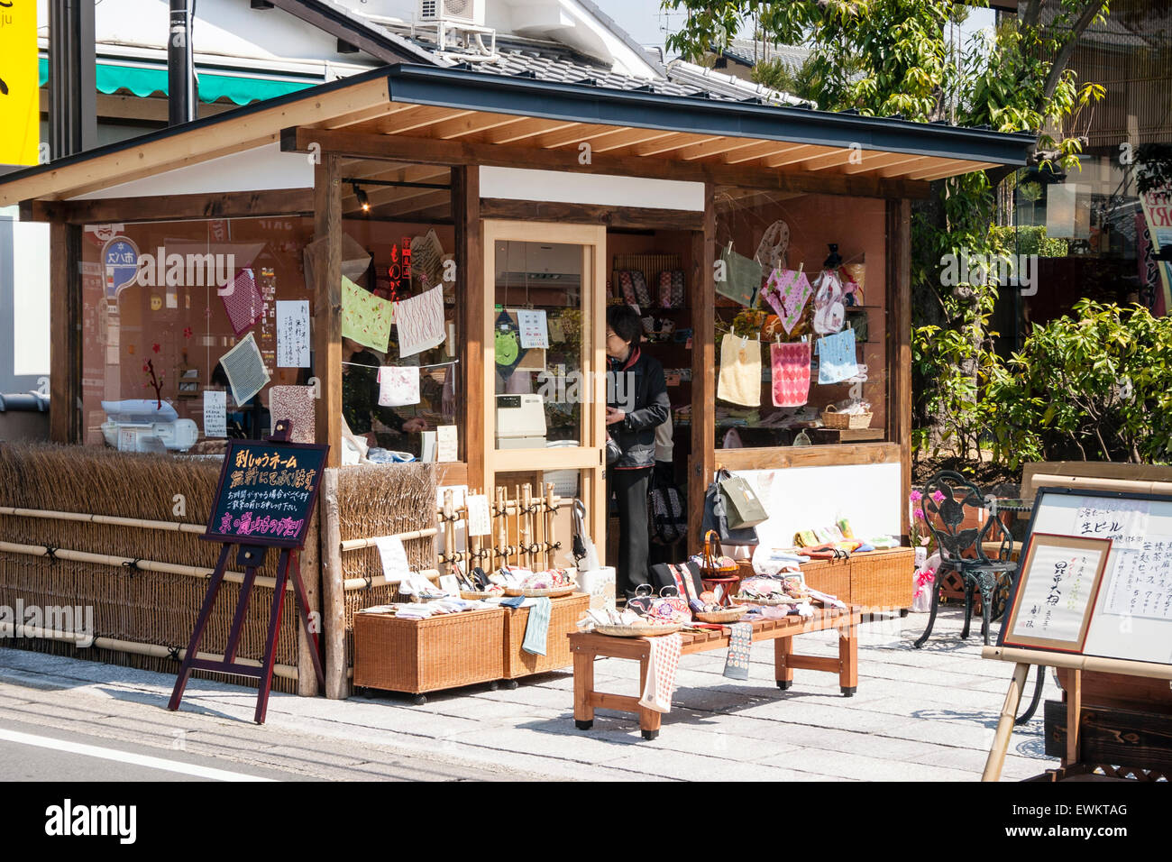 Kyoto, Arashiyama. Small souvenir shop on raised deck on the street ...