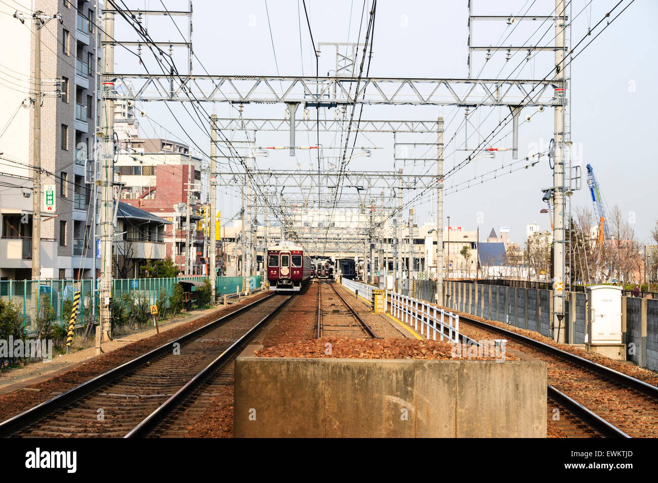 View along railway tracks to Hankju Nishinomiya Station in Japan. Known ...